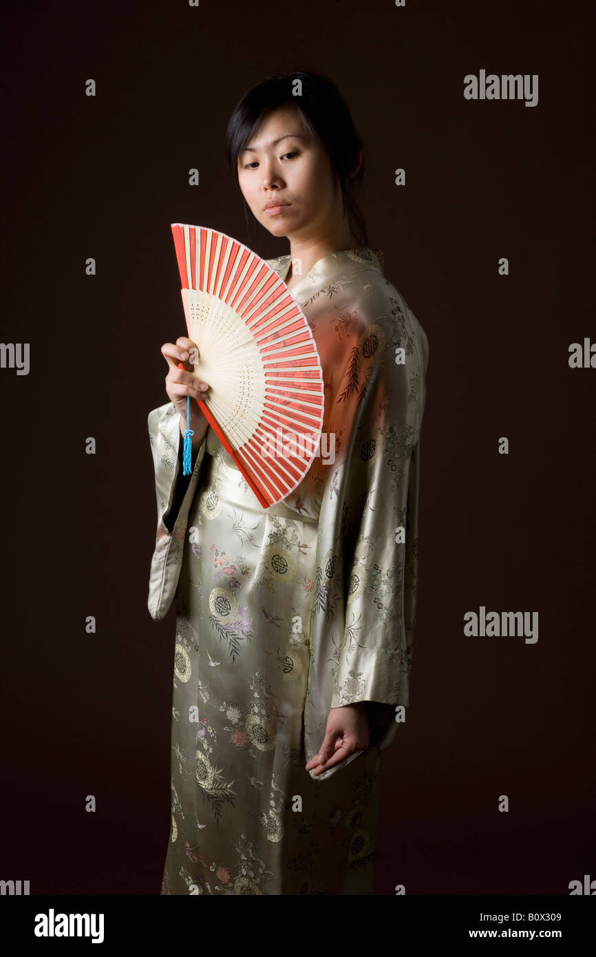Person in costume holding fan hi-res stock photography and images - Alamy