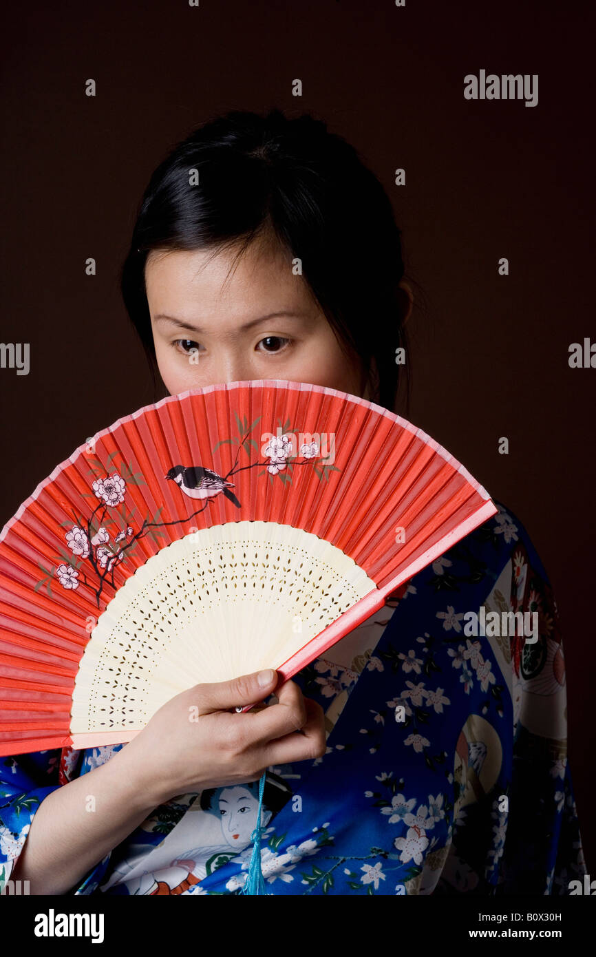 Woman in red kimono hi-res stock photography and images - Alamy