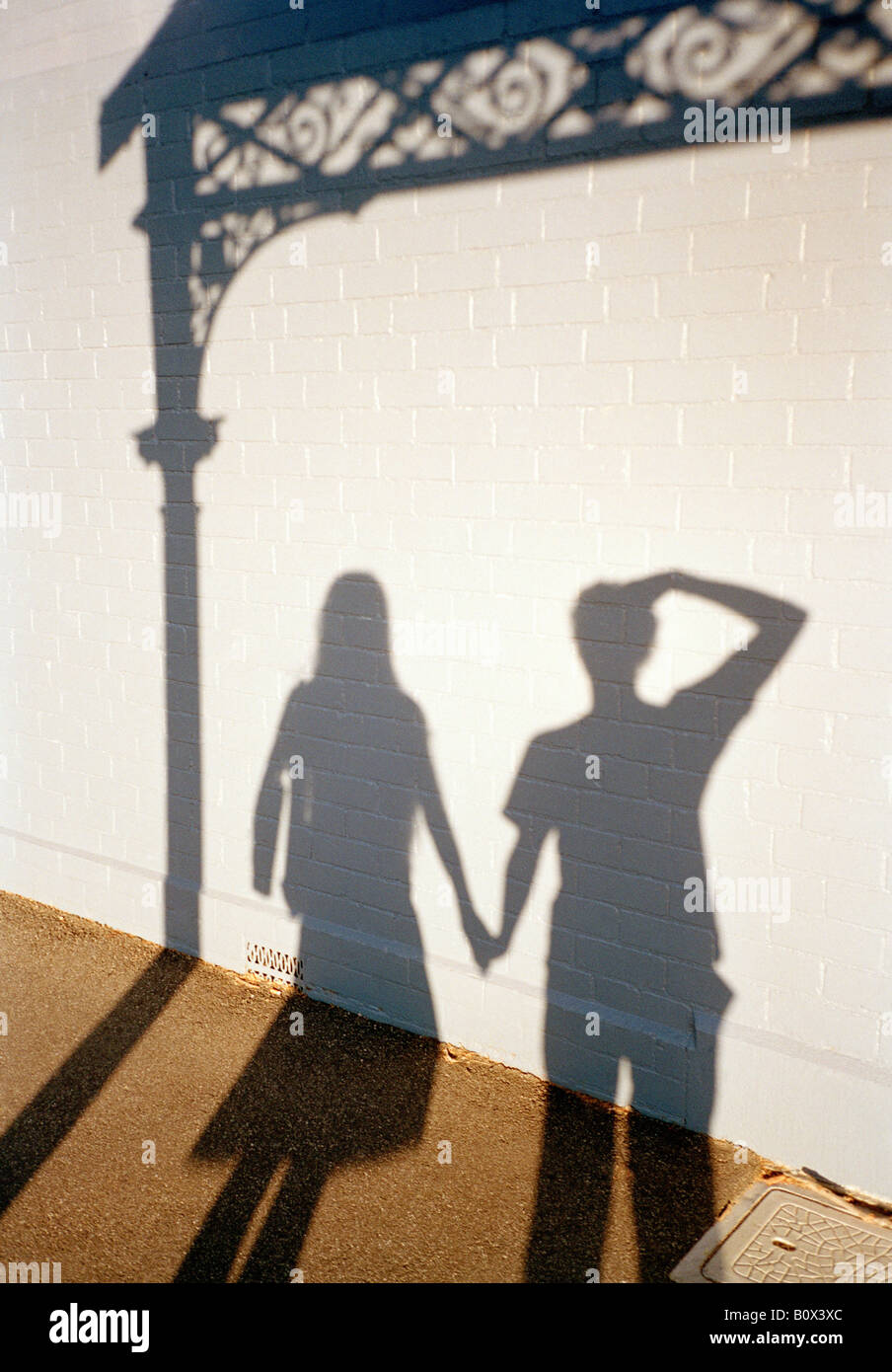 Shadows couple man woman standing on hi-res stock photography and ...