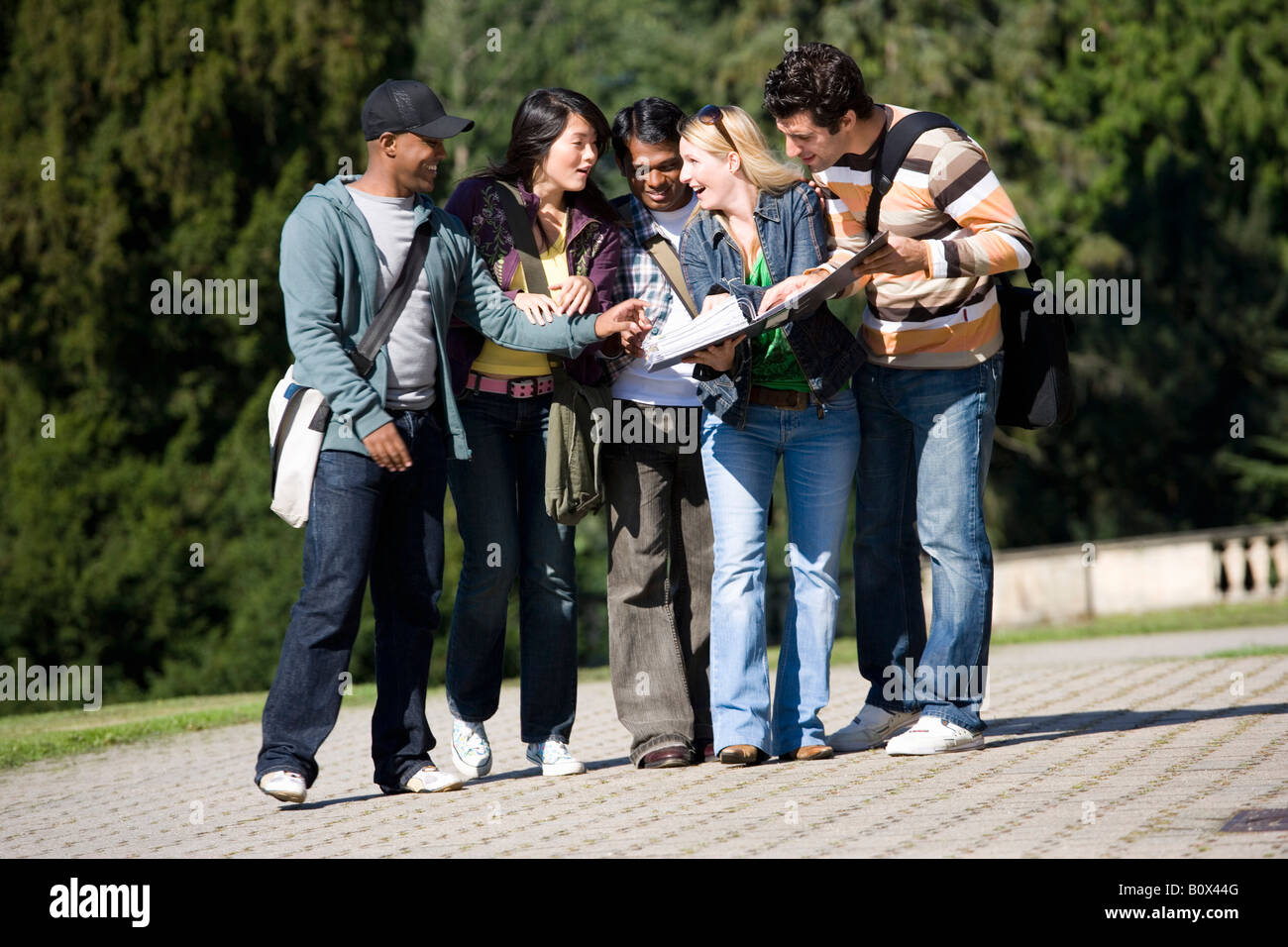 University students talking on campus Stock Photo - Alamy