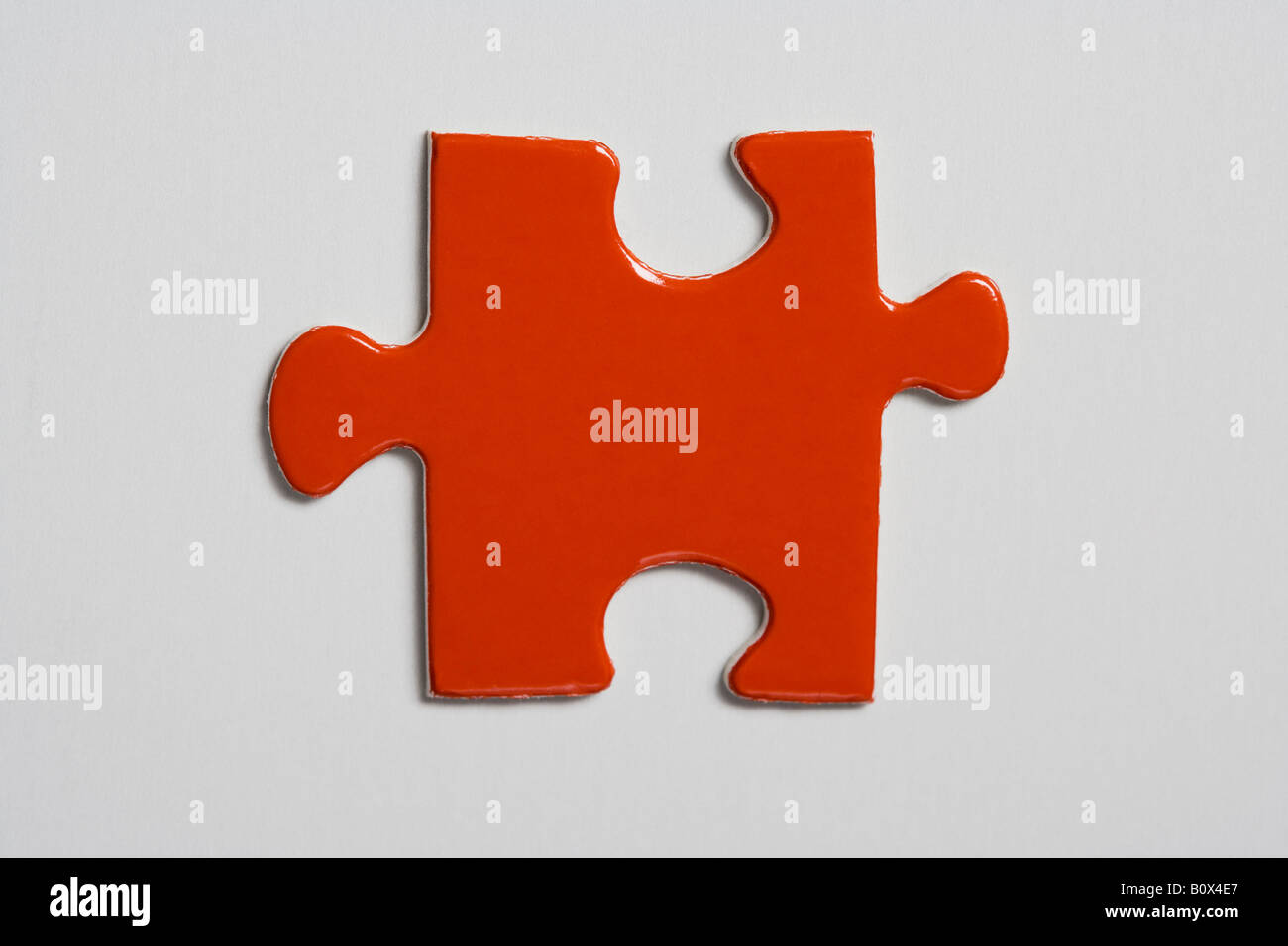 A red jigsaw piece Stock Photo - Alamy