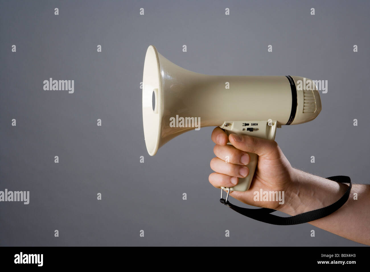 A man holding a megaphone Stock Photo - Alamy