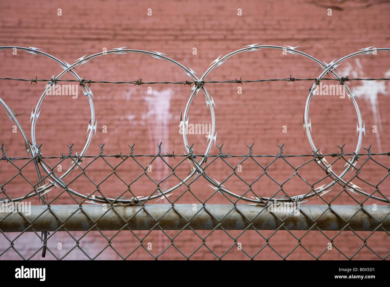 Razor wire atop a fence Stock Photo - Alamy