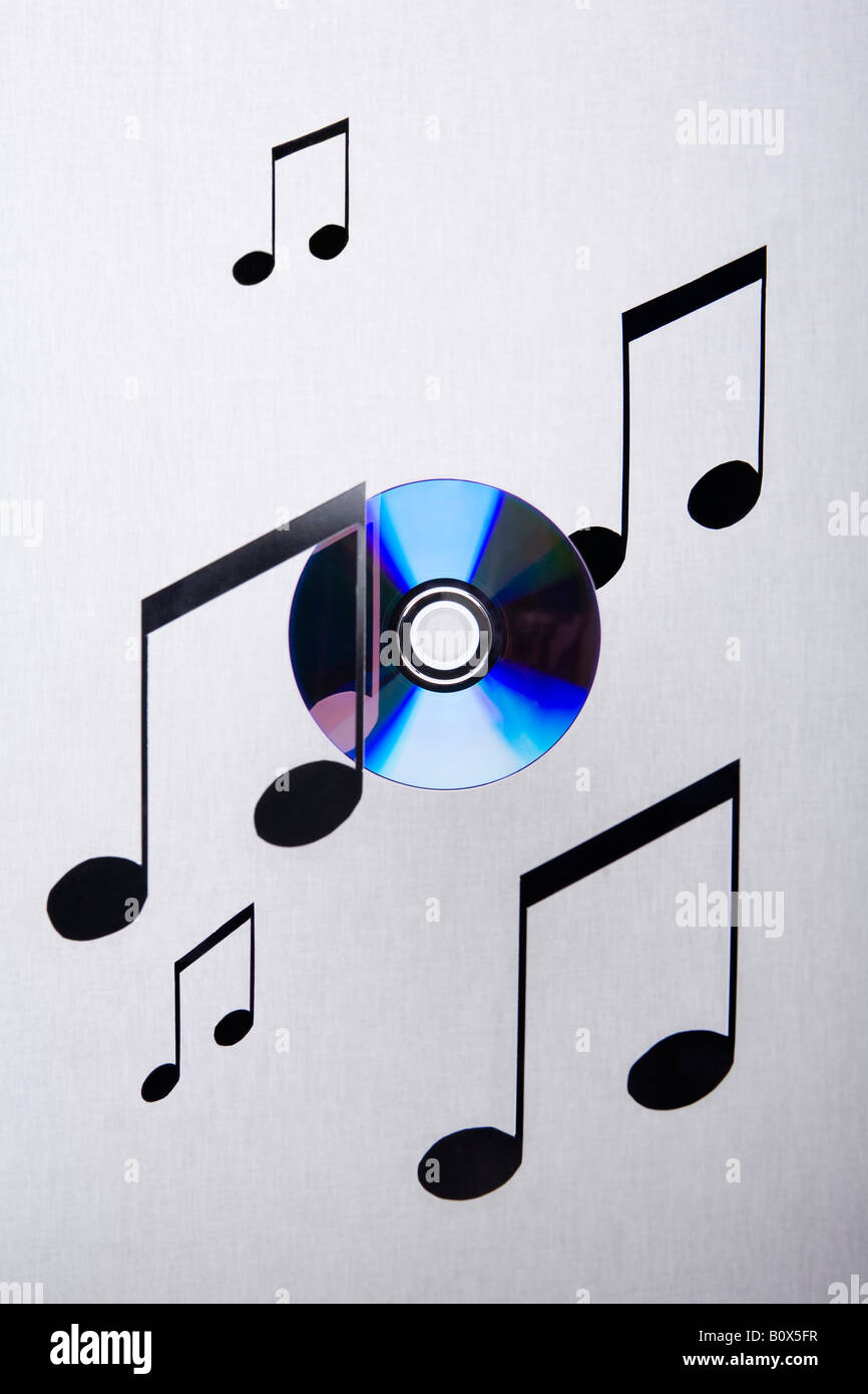 Musical notes and a CD suspended in mid-air Stock Photo - Alamy
