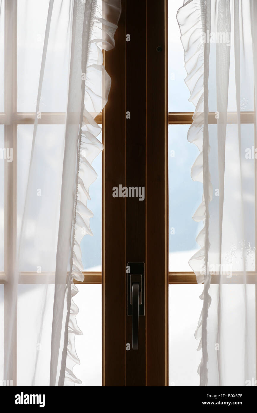 Windows with sheer curtain Stock Photo - Alamy