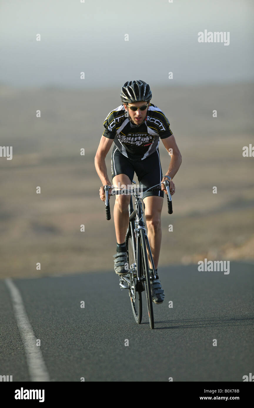 Cyclist on a road racing bike Stock Photo - Alamy