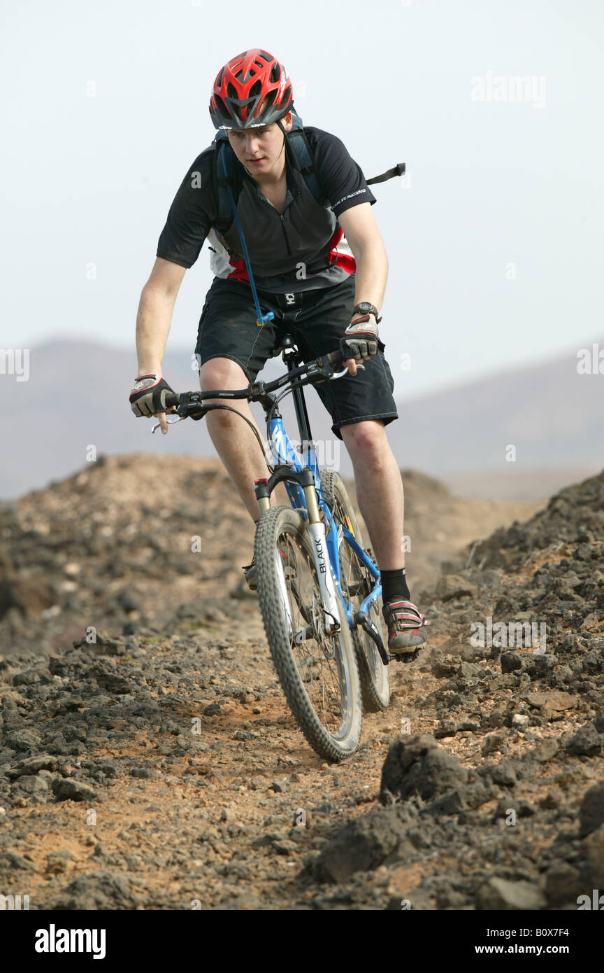Mountain Biker riding in a rocky landscape Stock Photo - Alamy