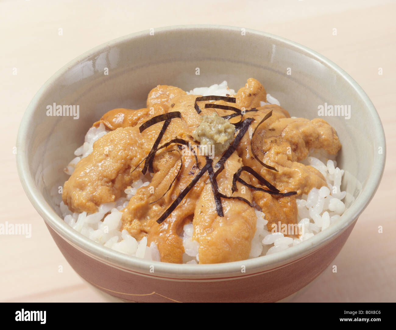 Steamed rice topped with sea urchin Stock Photo - Alamy
