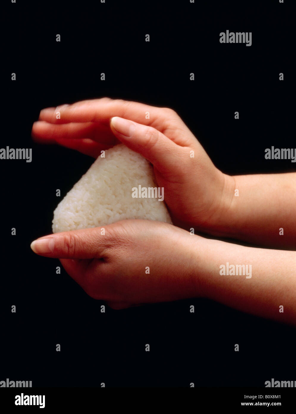 Person's hands making rice ball hi-res stock photography and images - Alamy