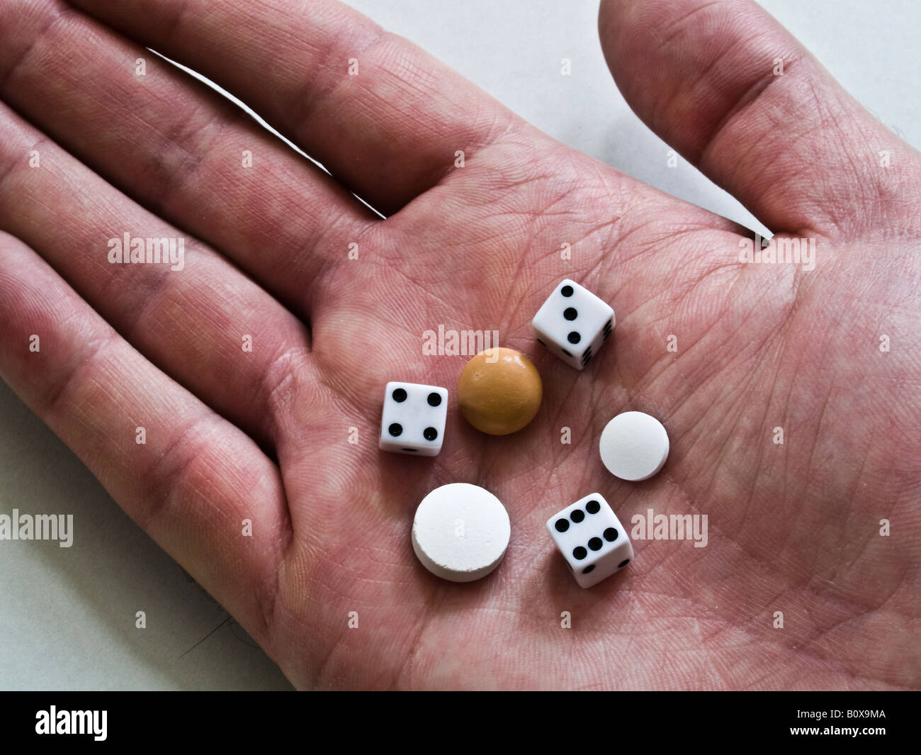 Hand with dice hi-res stock photography and images - Alamy