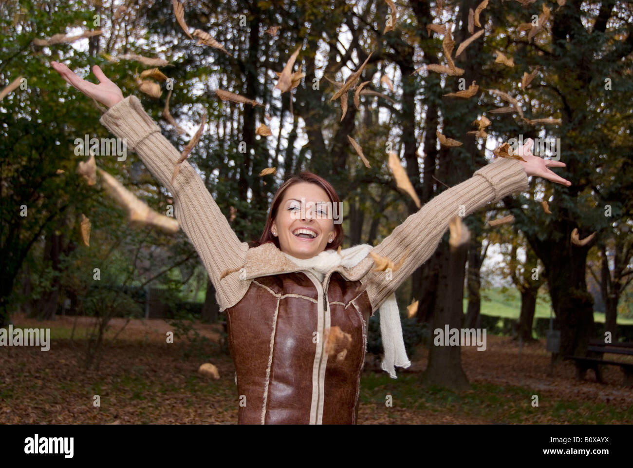 Young woman throwing clothes from hi-res stock photography and images ...
