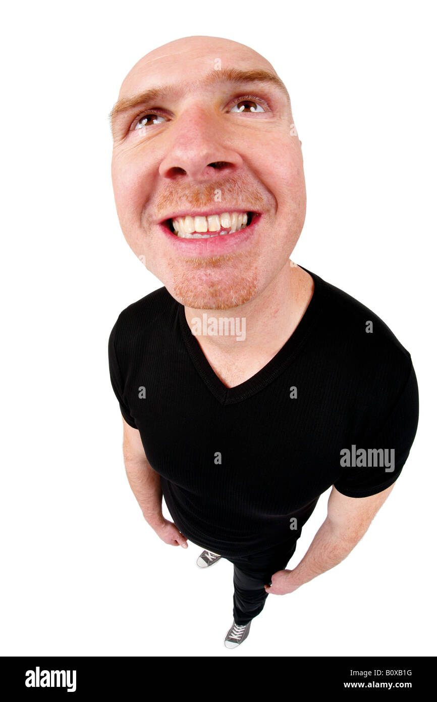 bald headed man is grinning and looking up Stock Photo - Alamy
