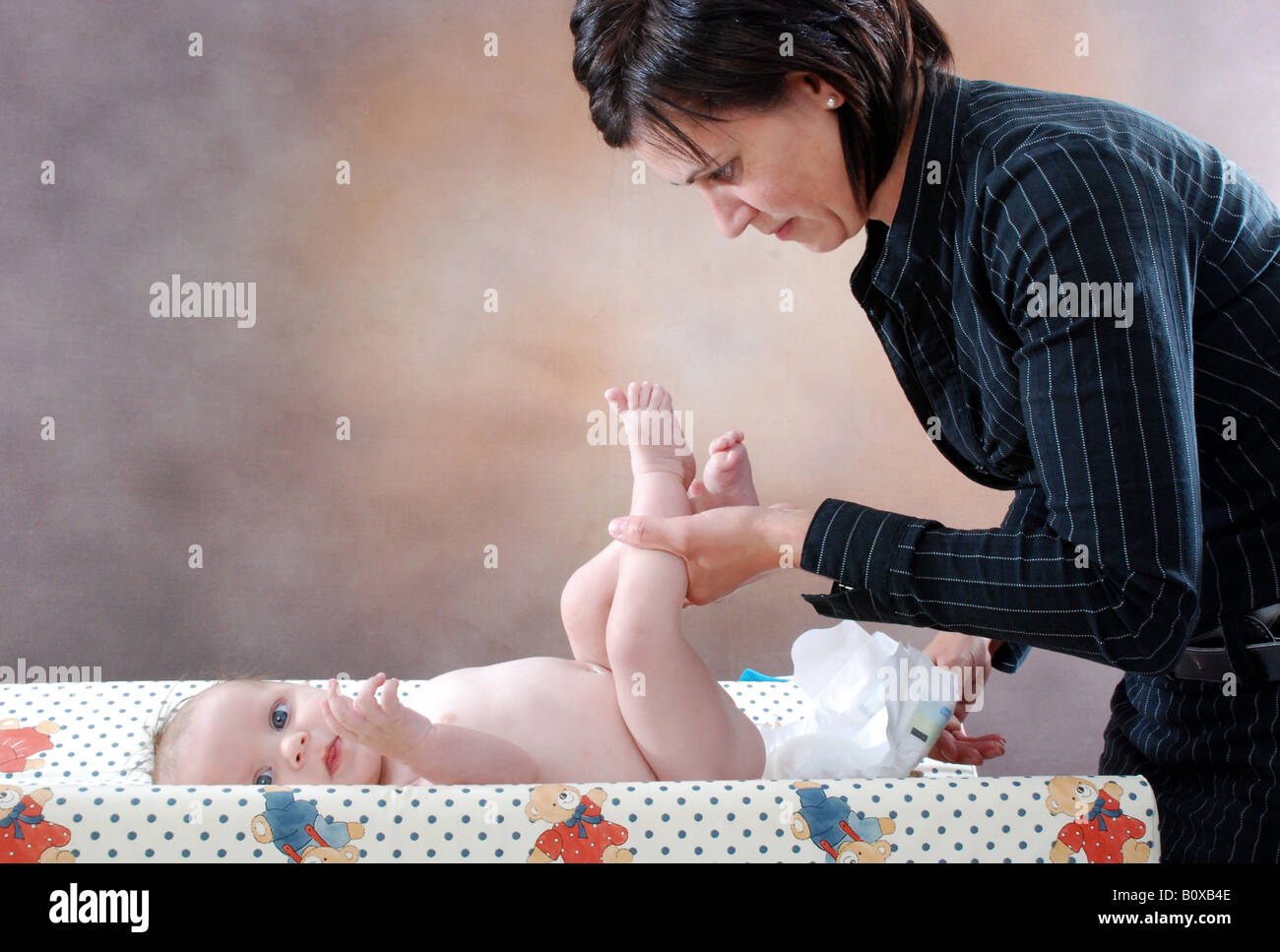 Two women changing diaper hi-res stock photography and images - Alamy
