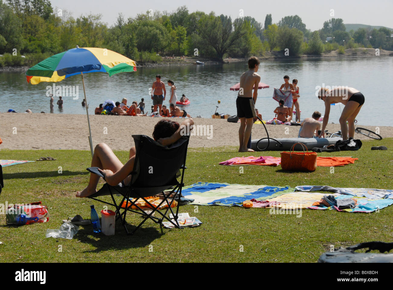 people at the bathing lake near Otterstadt, Germany, Rhineland ...