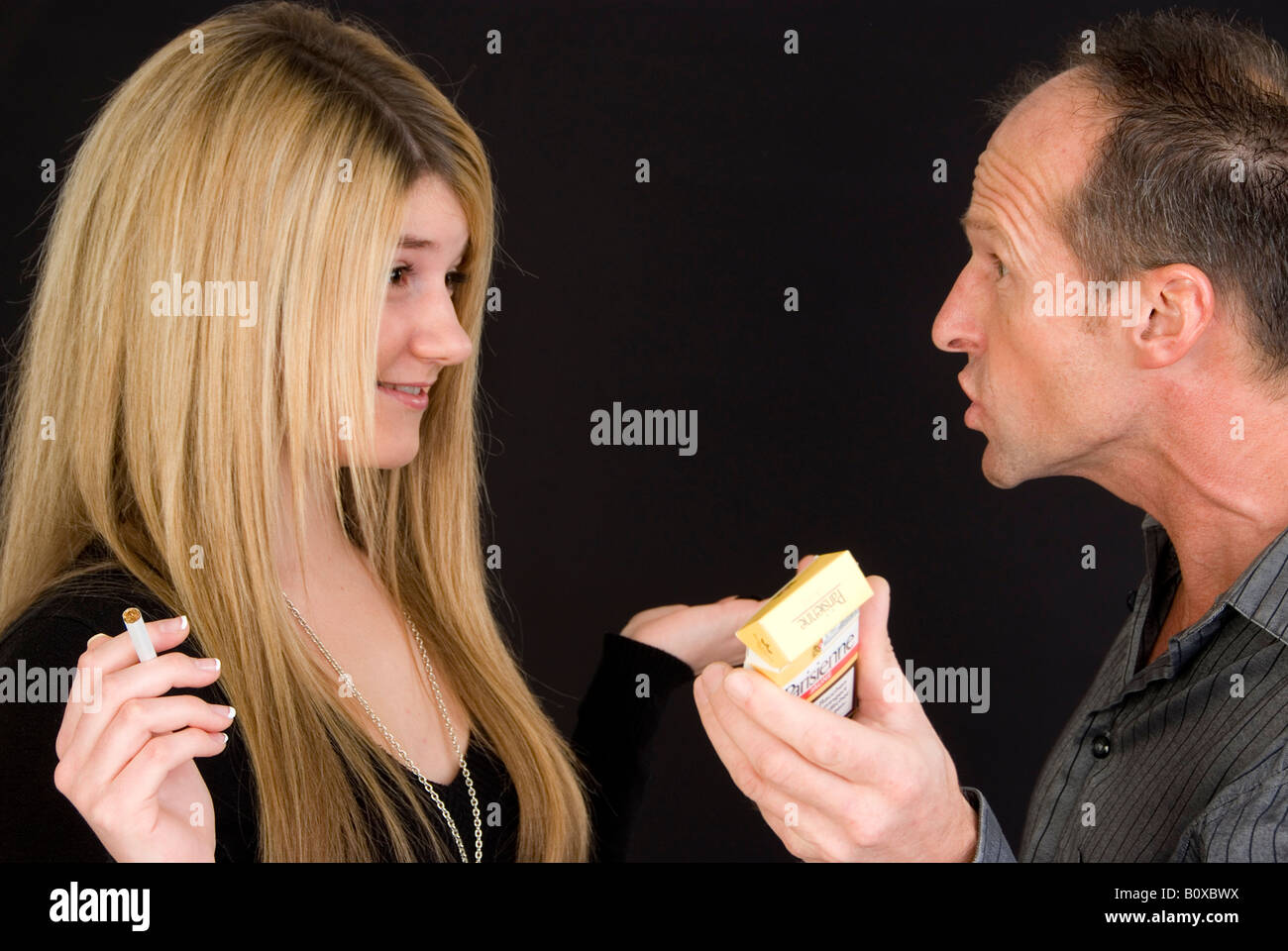 father catches daughter at smoking Stock Photo - Alamy
