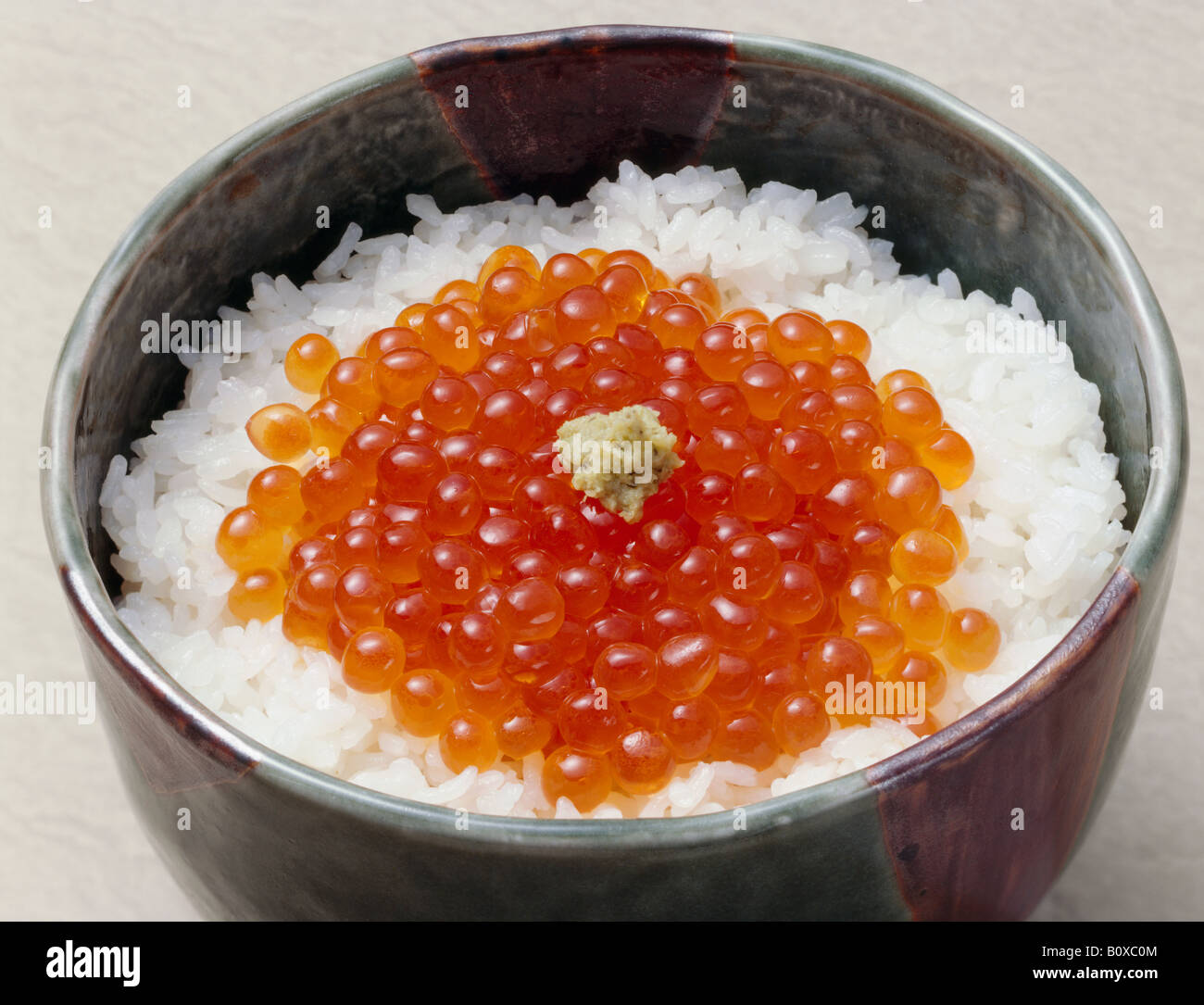 Steamed rice topped with salmon roe Stock Photo - Alamy
