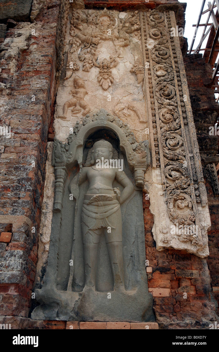 A Dvarapala statue in a niche of Preah Ko honouring maternal ancestors ...