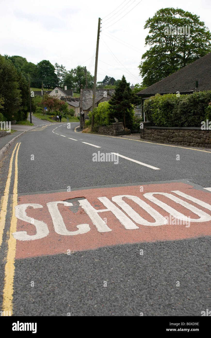 school warning sign painted on road surface Stock Photo - Alamy
