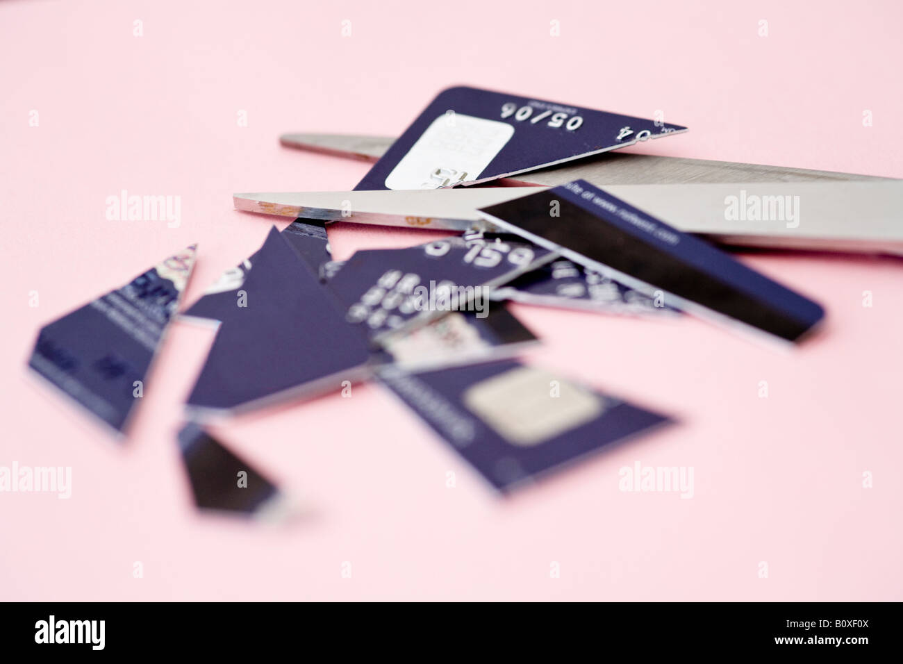 Cut up and destroyed credit card with scissors Stock Photo - Alamy