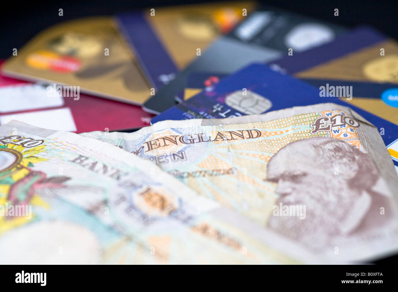 Pile of ten pound notes and credit cards Stock Photo - Alamy