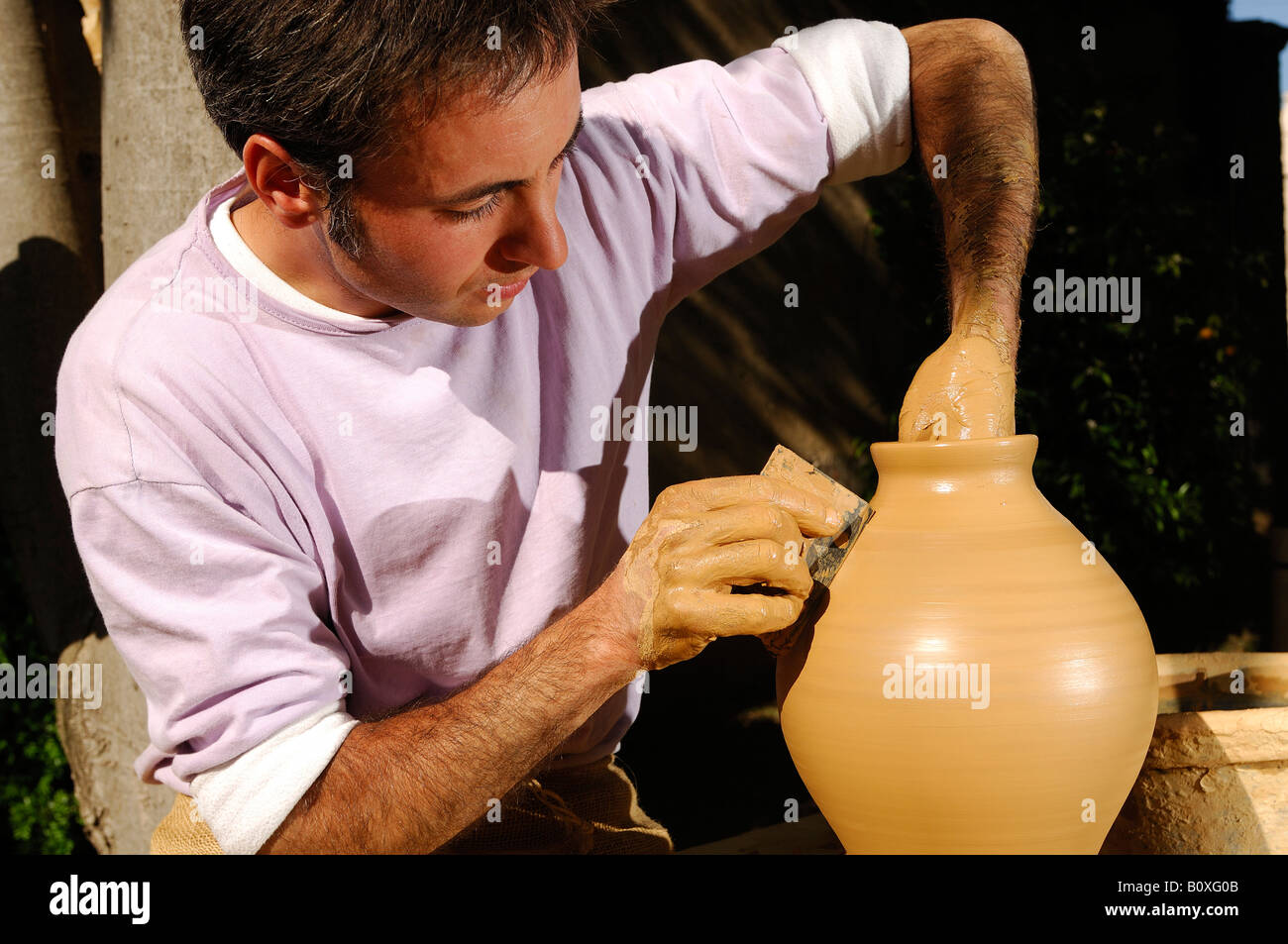 Ceramist creating a typical object by hand. Traditional technique Stock ...