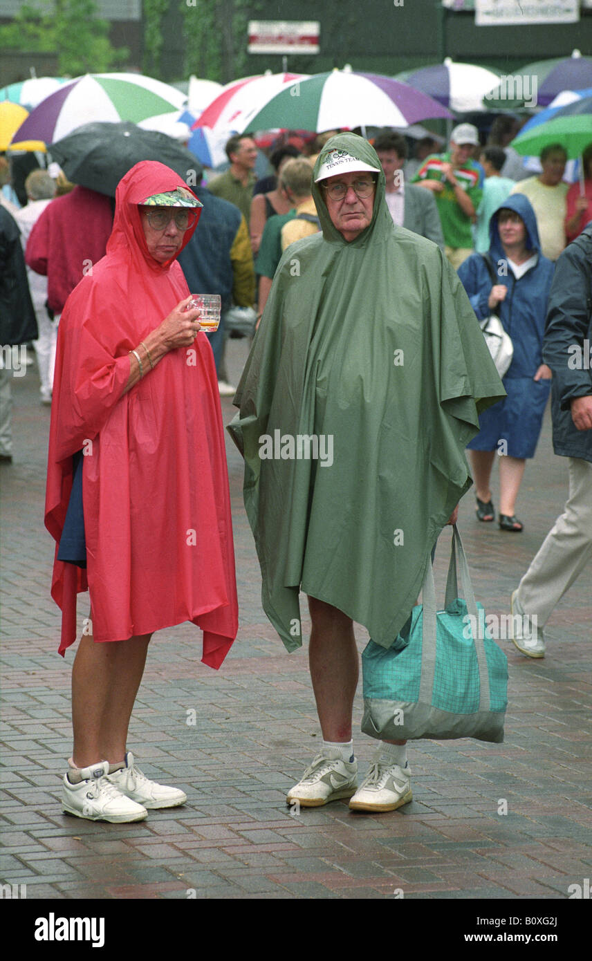 Wet tennis fans at Wimbledon. wet weather rain raining Britain Uk ...