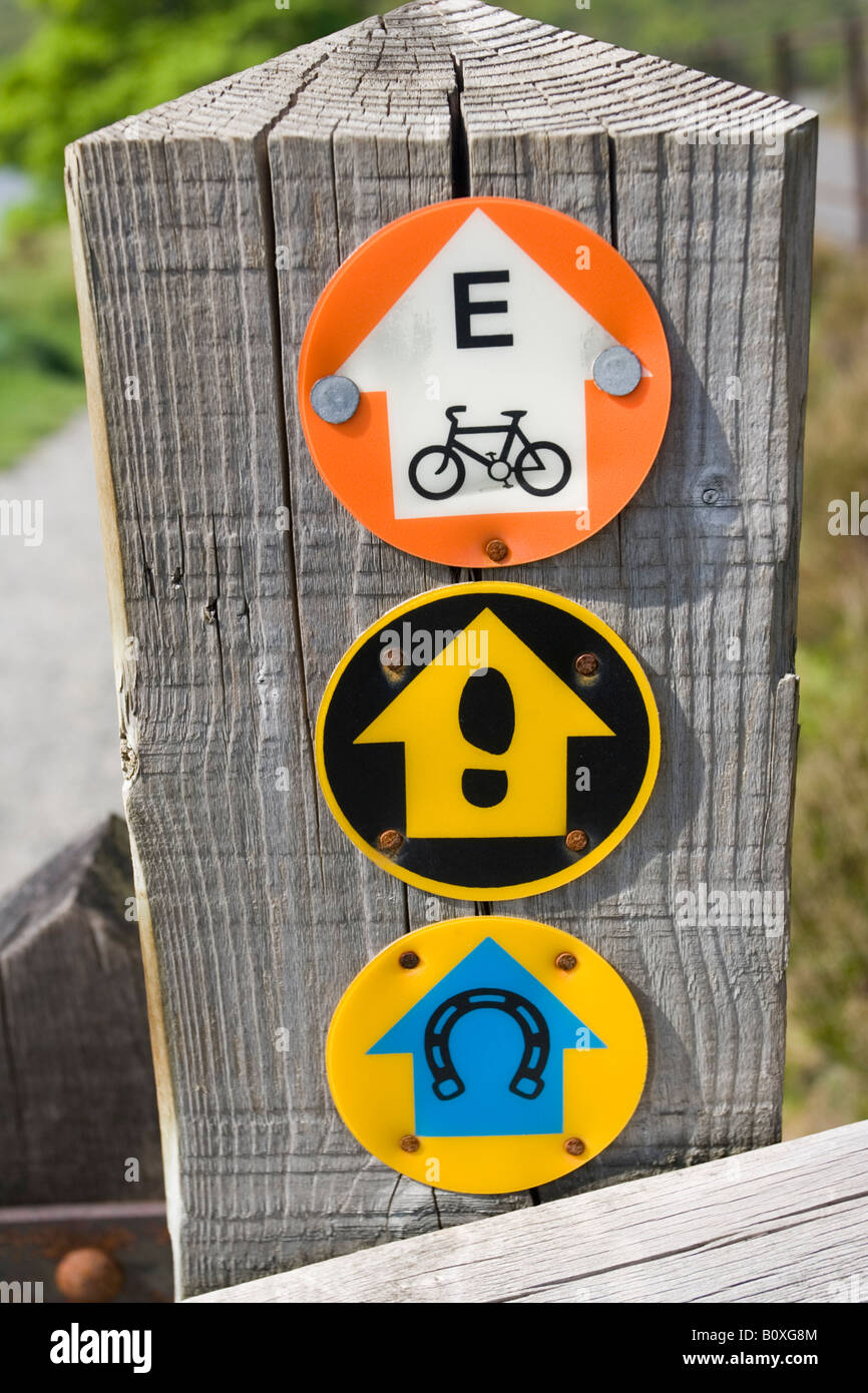 Three waymark signs on wooden post cycling walking horse riding Wales ...