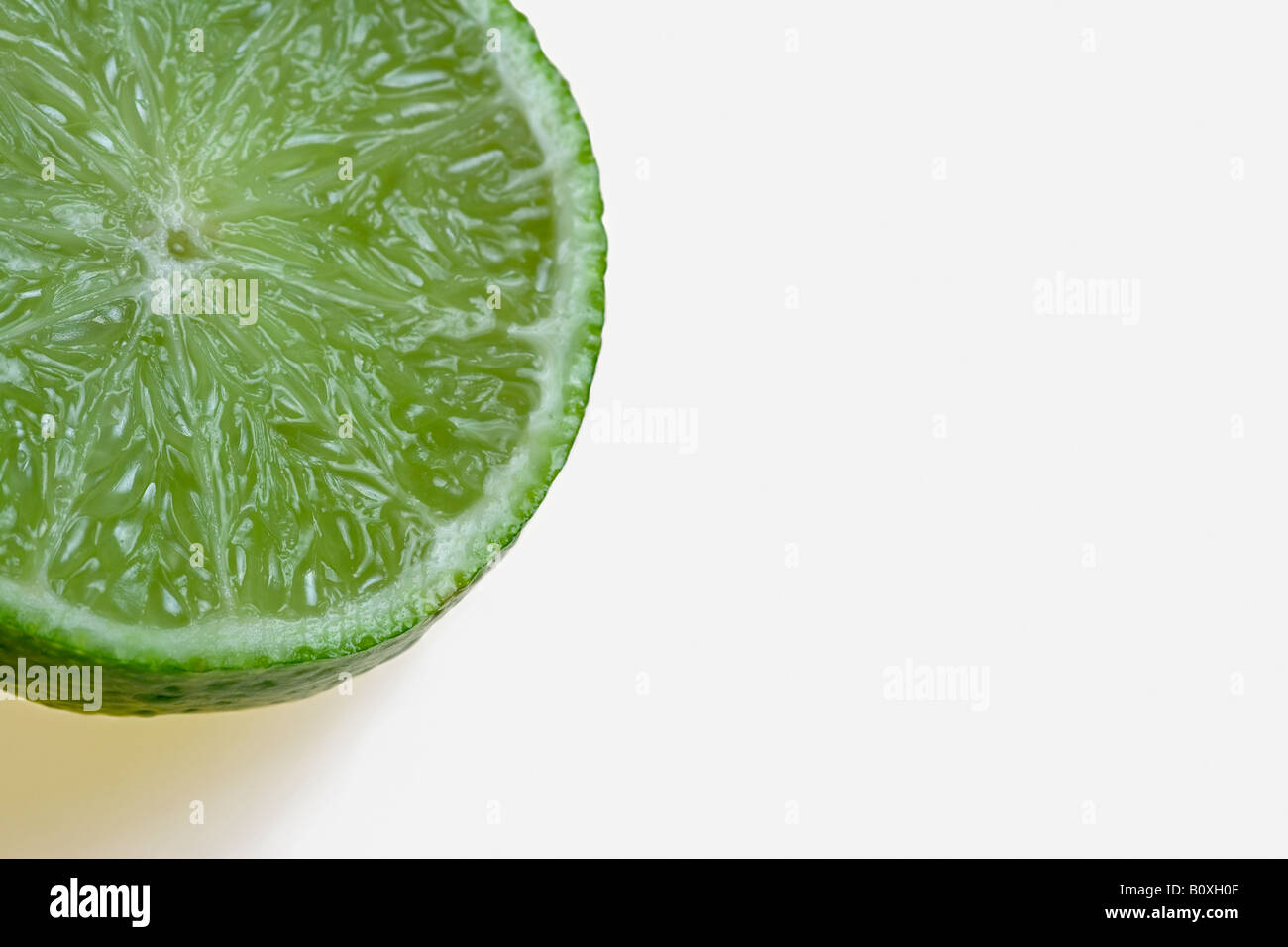 Lime cut in half Stock Photo - Alamy