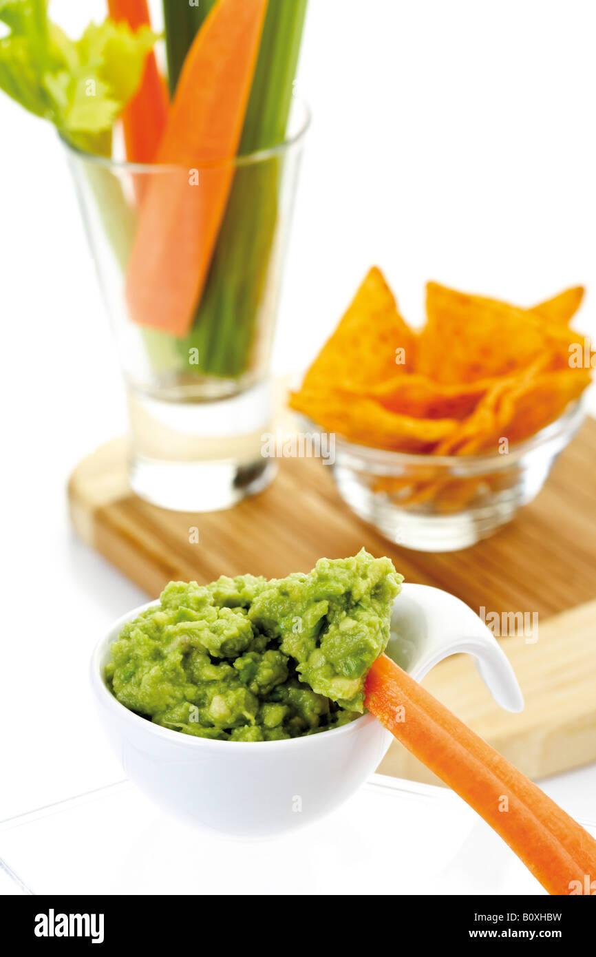 Guacamole with vegetable sticks and tortilla chips Stock Photo - Alamy