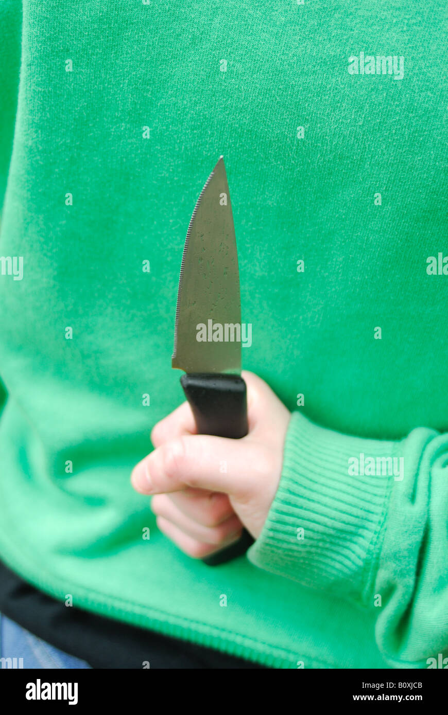 Holding Knife Behind Back Stock Photo - Alamy