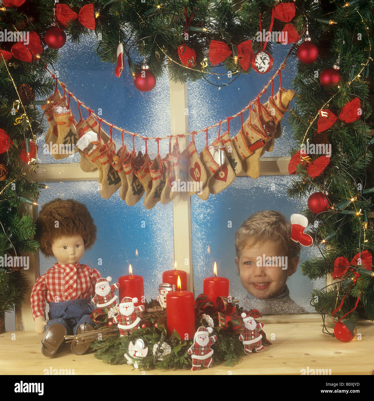 advent calendar in front of window Stock Photo - Alamy