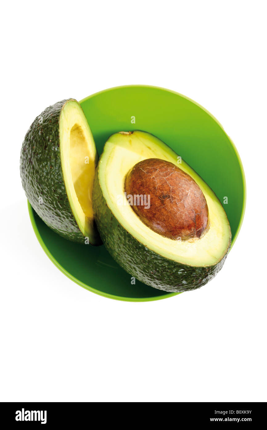 Avocado in bowl, cross section Stock Photo - Alamy