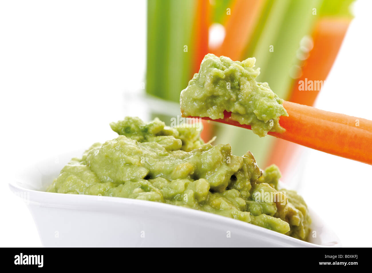 Guacamole with vegetable sticks Stock Photo - Alamy
