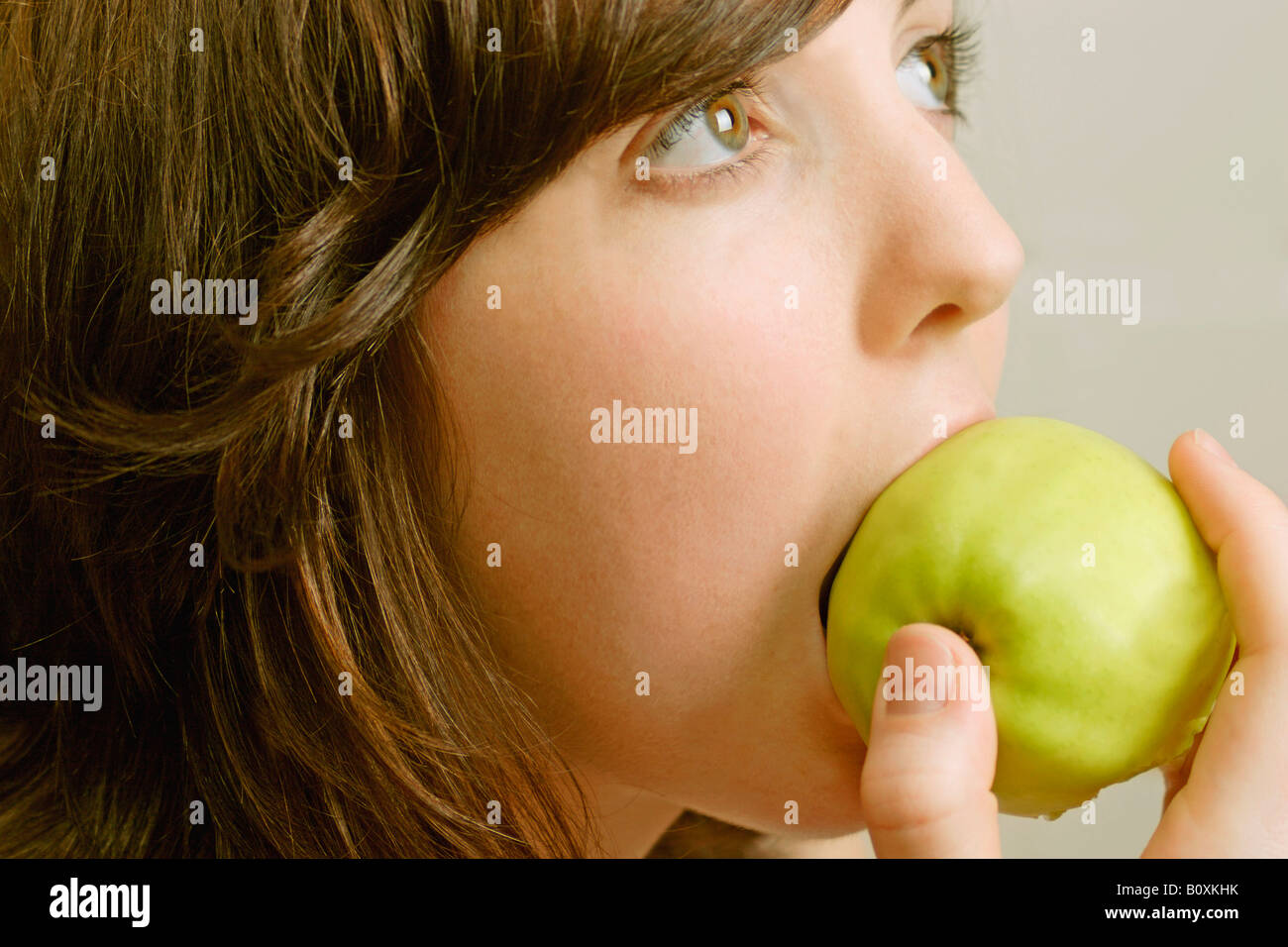 Eating an apple Stock Photo - Alamy