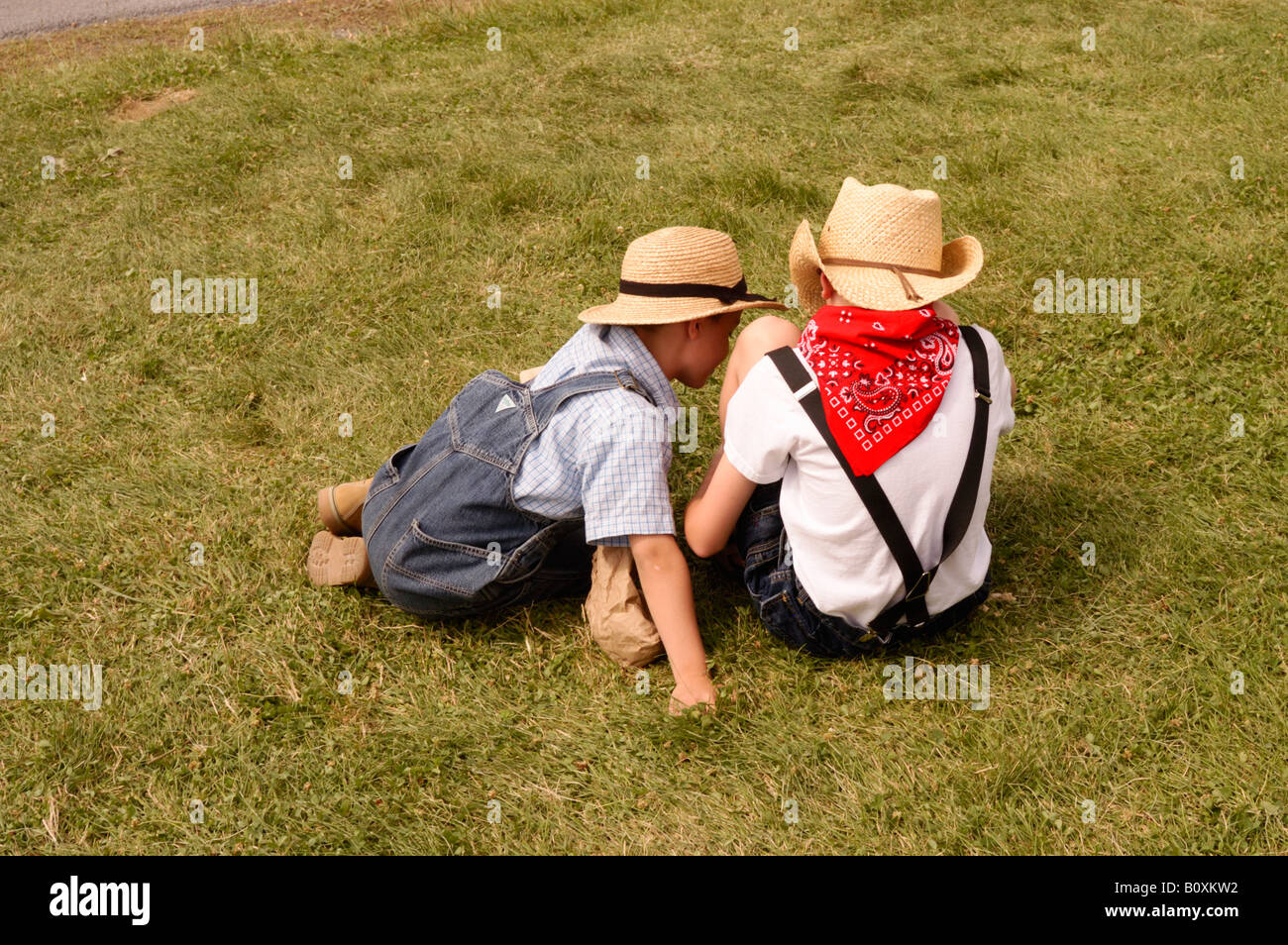 Farm children on grass Stock Photo - Alamy