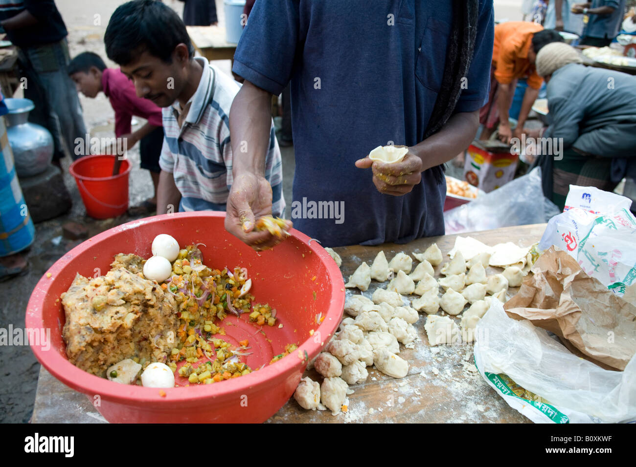 Men making samosas at a street food stand in Dhaka Stock Photo - Alamy