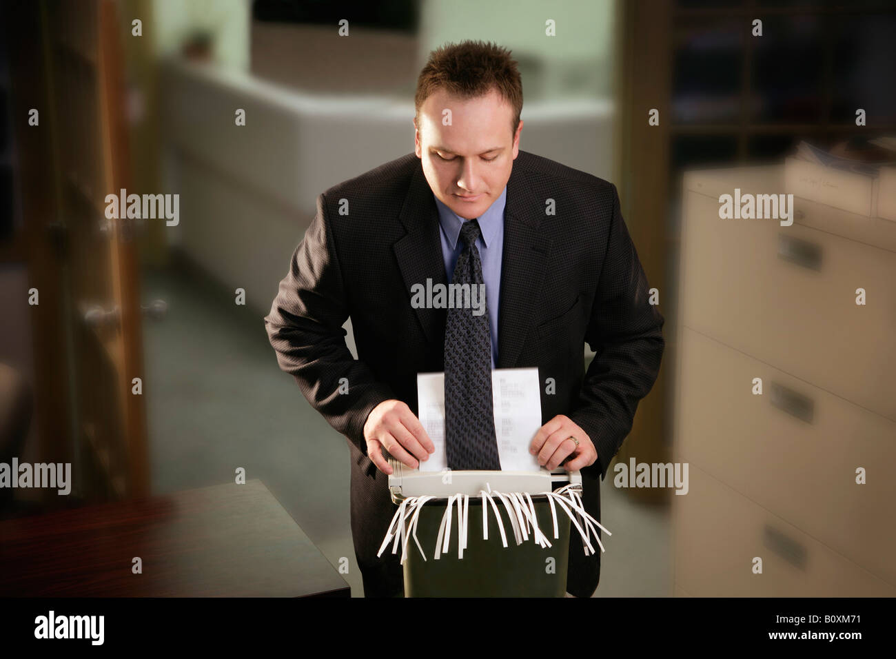 Person Shredding Paper