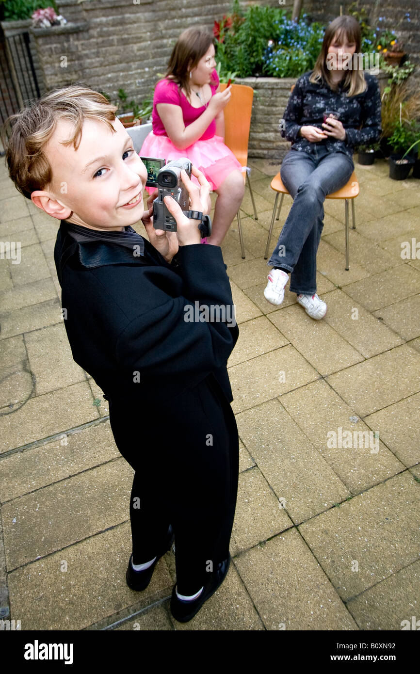 young boy in suit using video camera (camcorder Stock Photo - Alamy