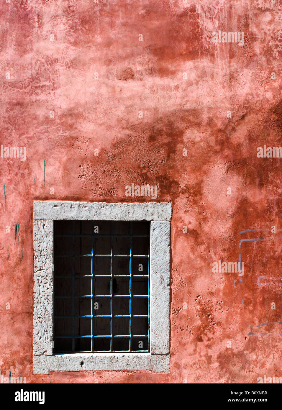Bared or grilled window in an old wall Stock Photo - Alamy