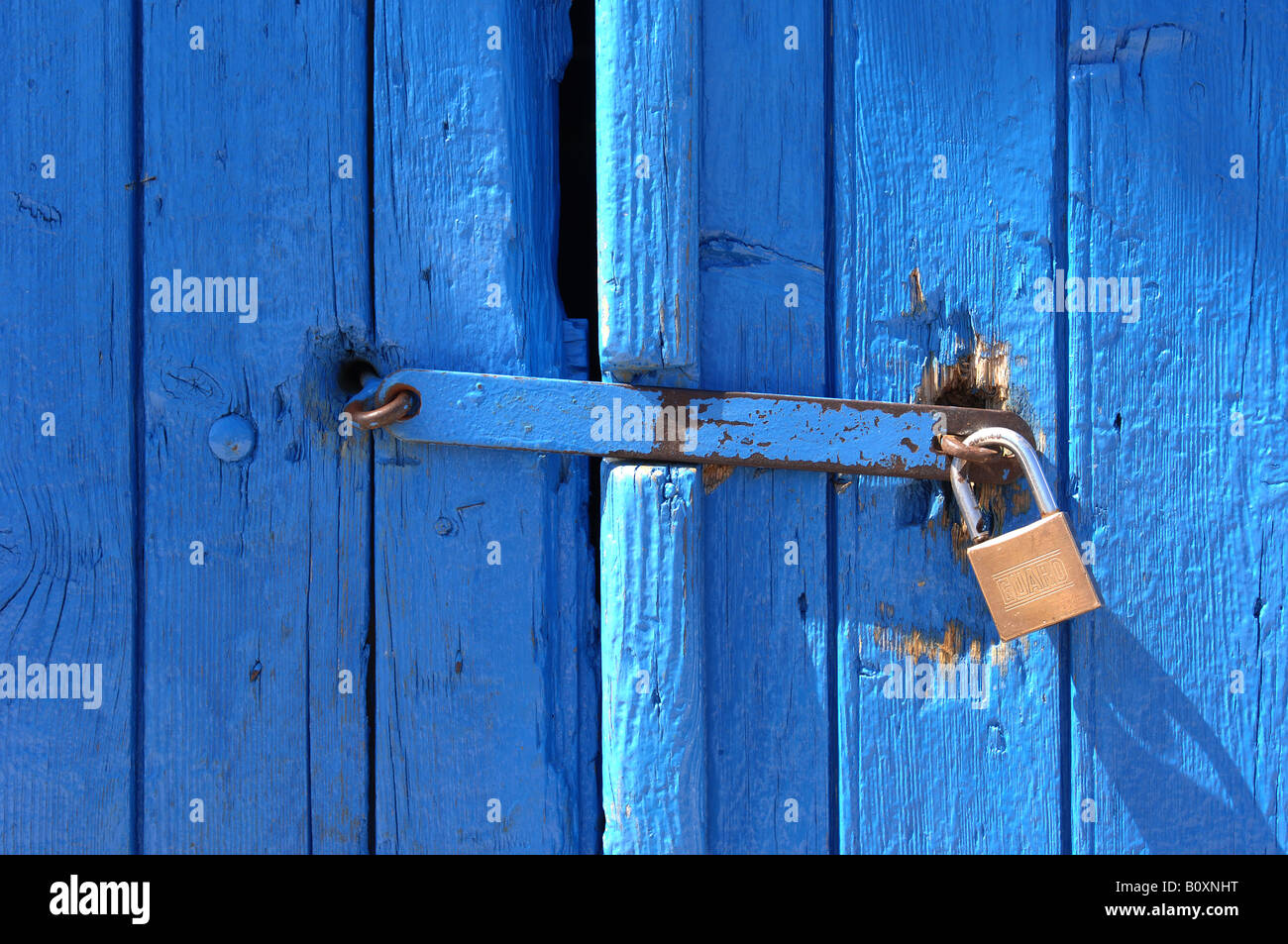 Blue door with padlock Stock Photo - Alamy