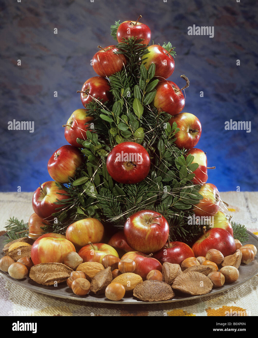 Christmas pyramid with apples Stock Photo - Alamy