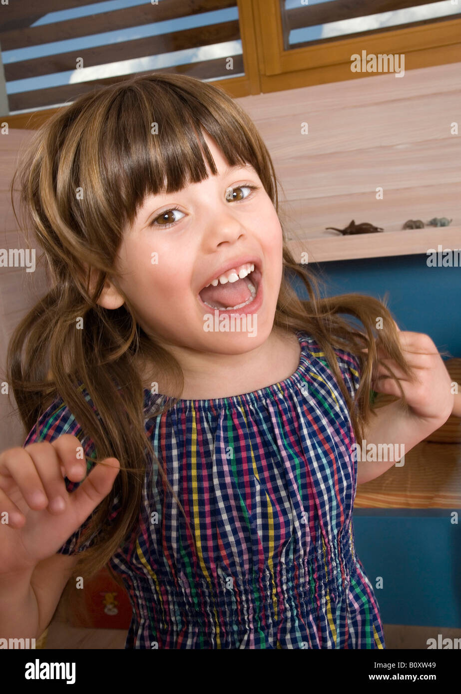 Girl (6-7) smiling, portrait Stock Photo - Alamy