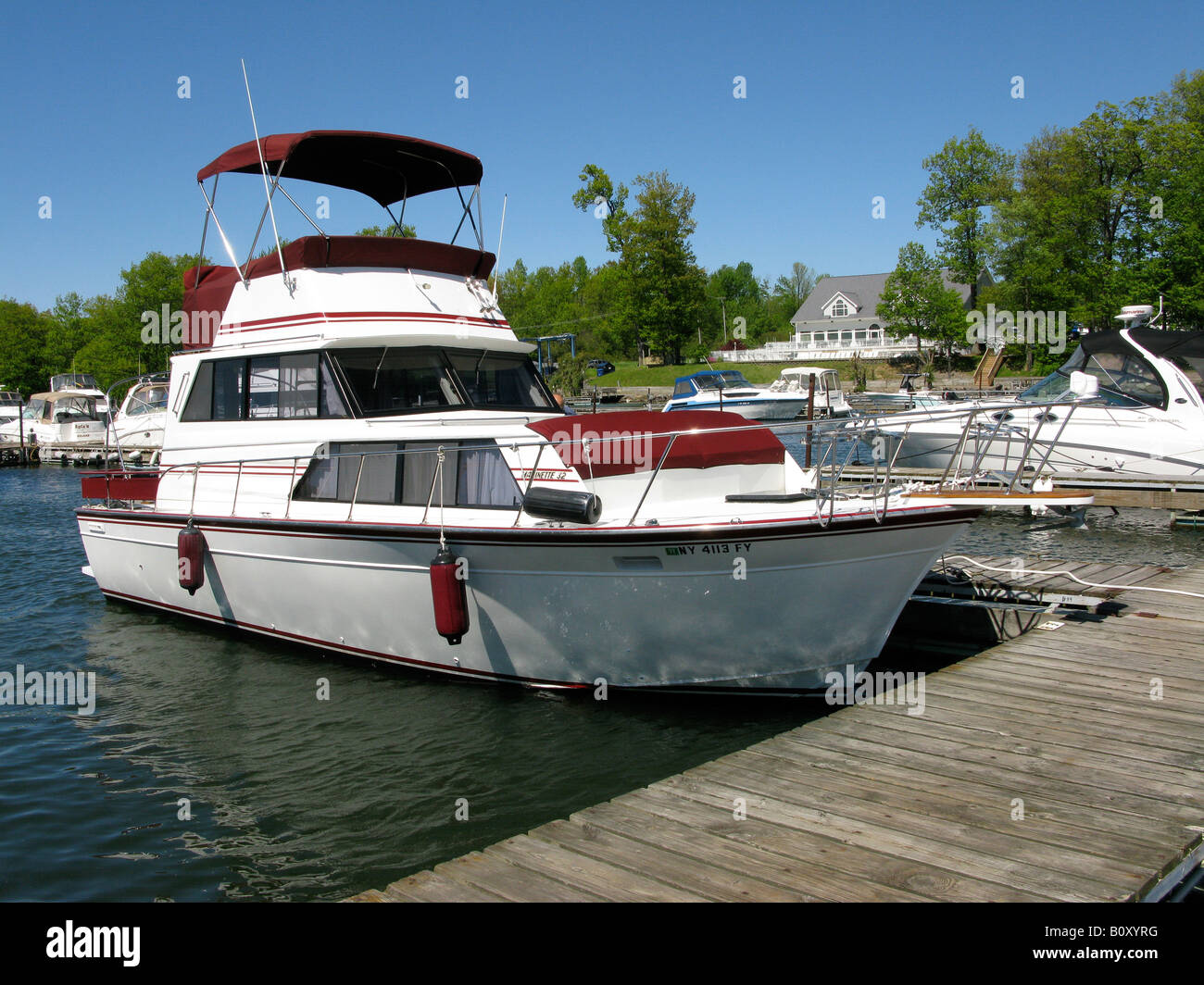 Luxury cabin cruiser at dock Stock Photo - Alamy