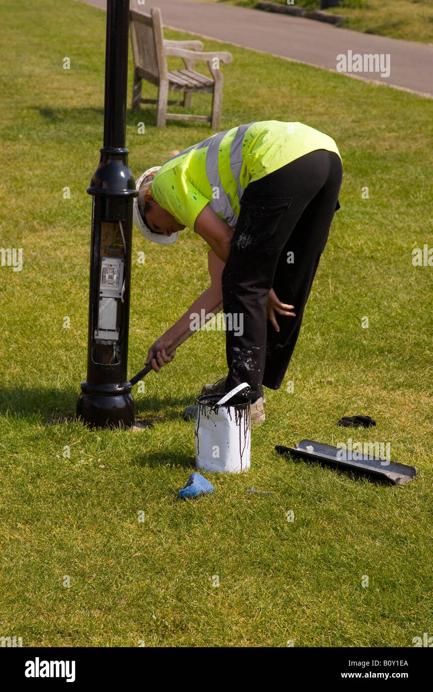Person Painting Lamp Post in the uk Stock Photo - Alamy