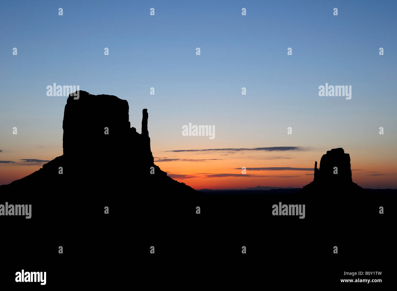 Monument Valley Silhouettes of the Mitten Buttes at Sunrise Stock Photo ...