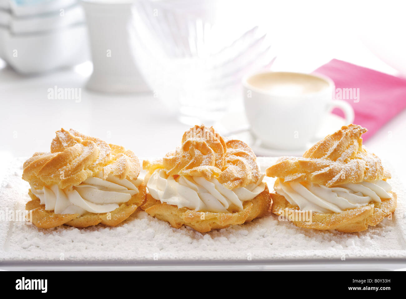Cream puffs on tray Stock Photo - Alamy