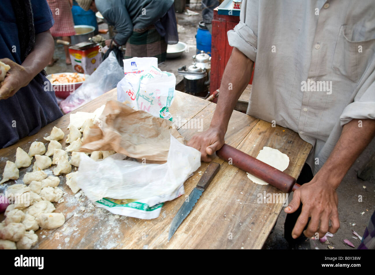 Men making samosas at a street food stand in Dhaka Stock Photo - Alamy