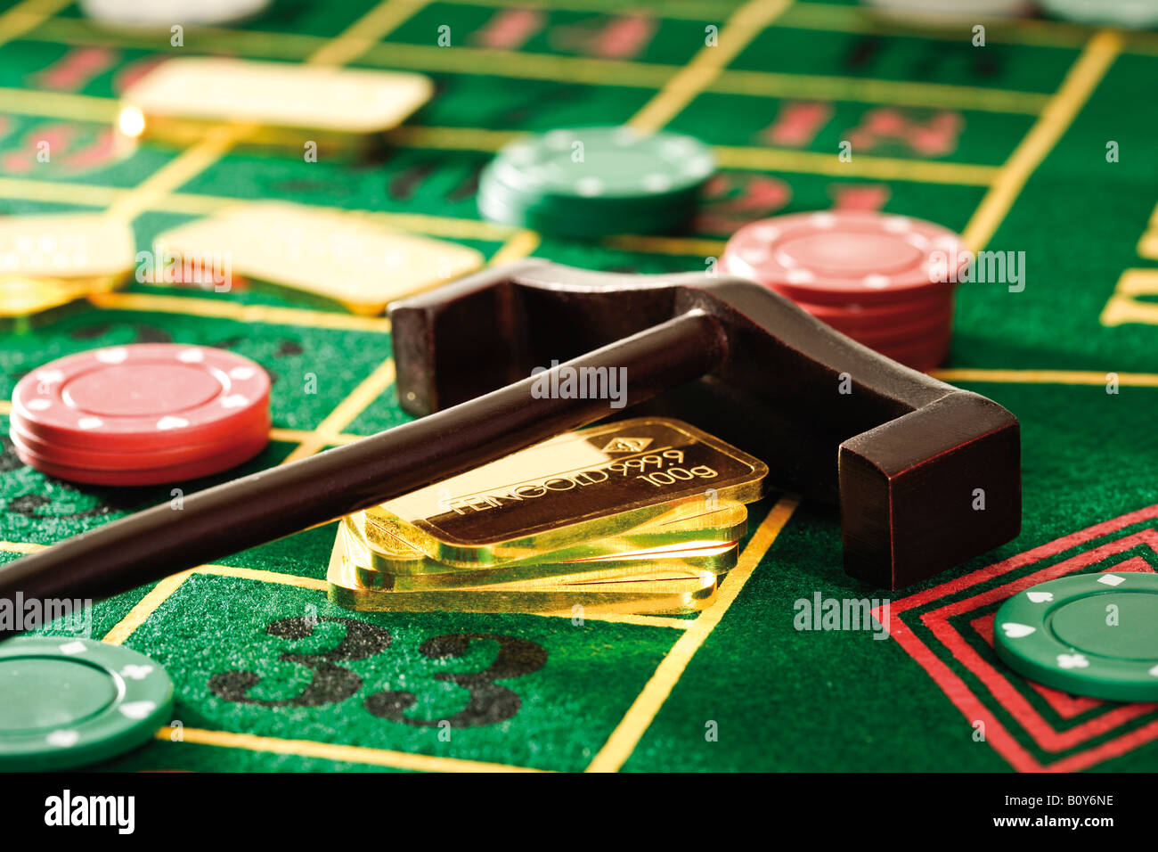 Gambling chips and gold bars on roulette table Stock Photo - Alamy