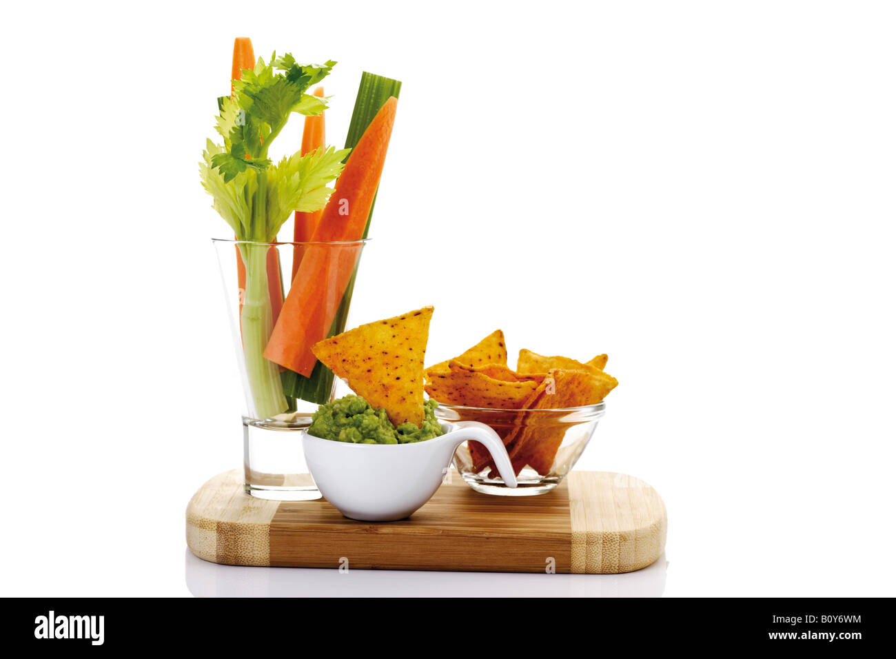 Guacamole with vegetable sticks and tortilla chips Stock Photo - Alamy