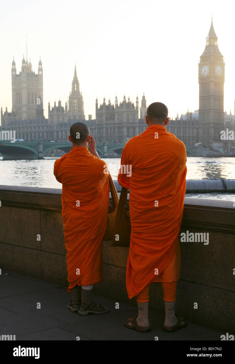 Two monks taking a photo of the House of Parliament London Stock Photo ...
